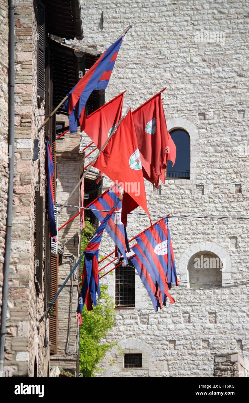 Flags of a district in the medieval town of Assisi, Italy Stock Photo ...