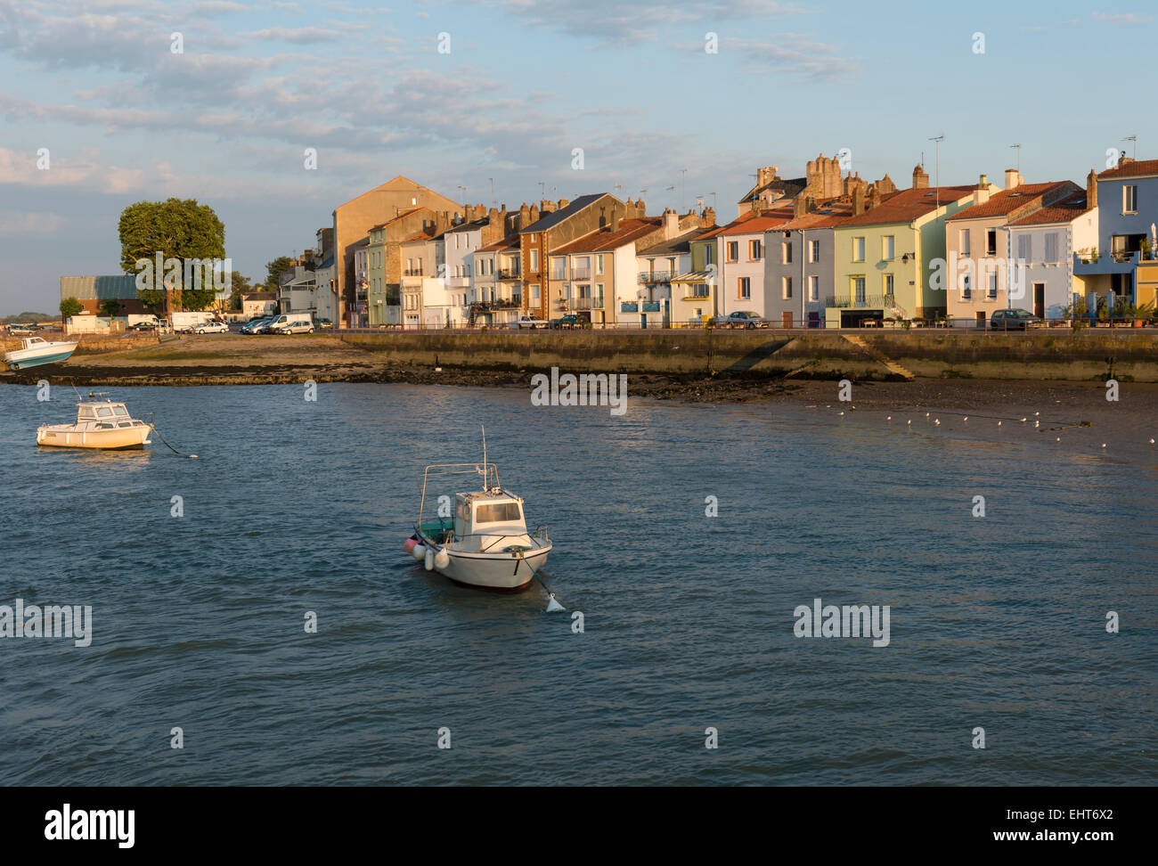 Sunset at the harbor, beach and colored houses at Paimboeuf in France ...