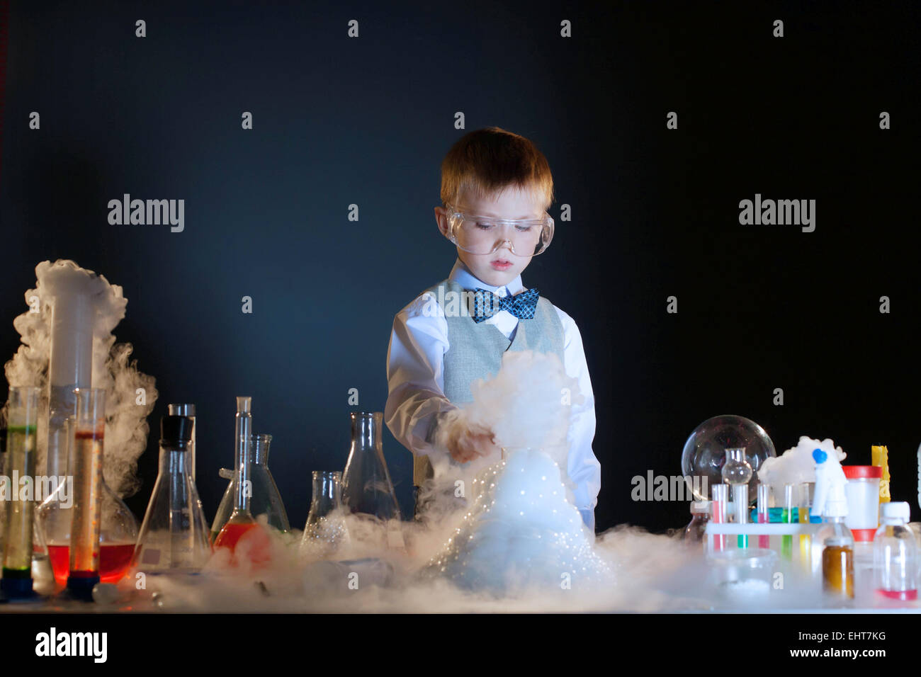 Adorable chemist experimenting with chemicals Stock Photo - Alamy