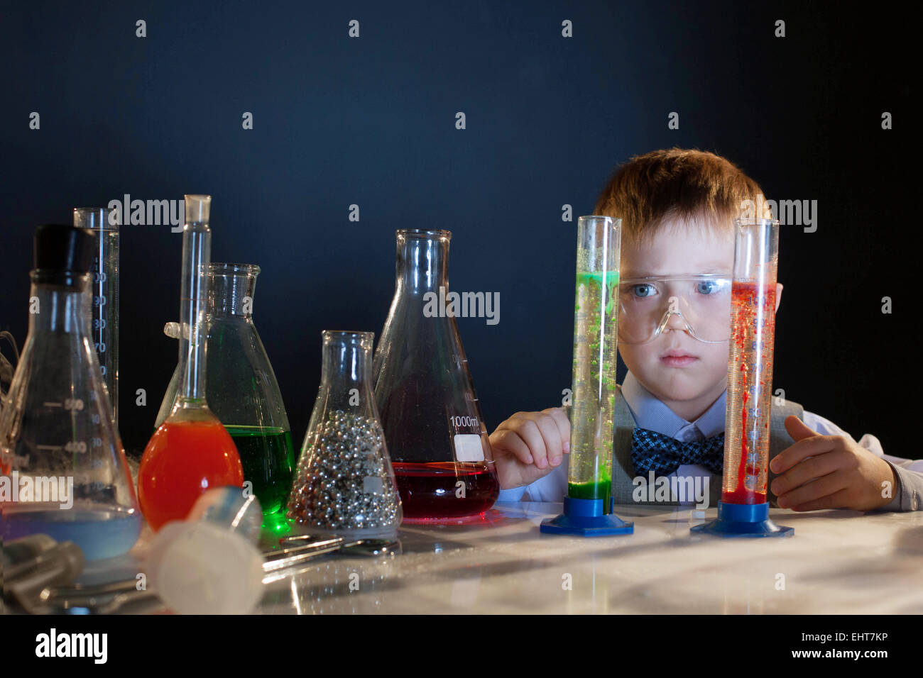 Handsome little boy posing with test-tubes Stock Photo - Alamy