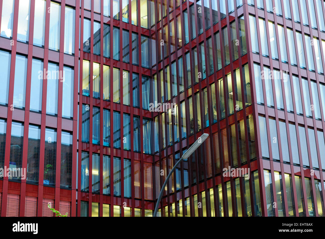 Red facade of an office building Stock Photo - Alamy