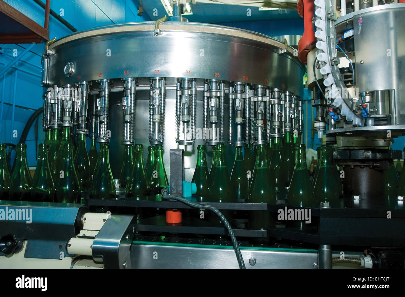 conveyor to spill champagne Stock Photo - Alamy