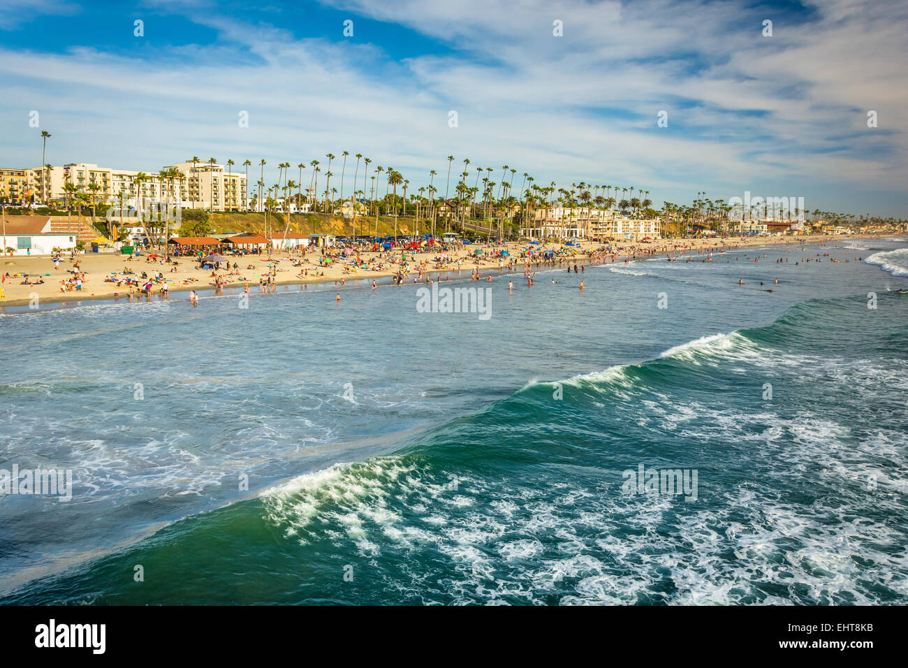 View of the beach and waves in the Pacific Ocean from the pier in ...