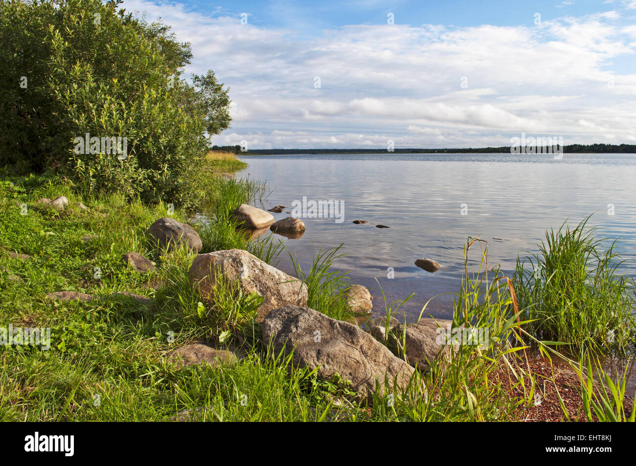 Boulders on the lake bank Stock Photo - Alamy