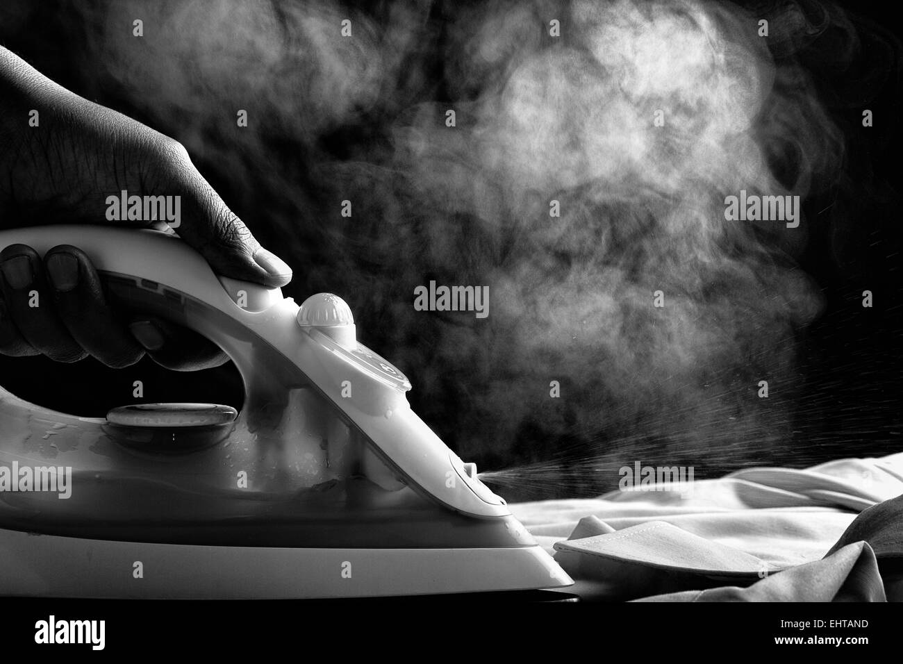 Ironing clothes Black and White Stock Photos & Images - Alamy
