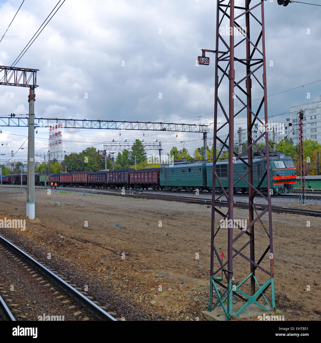 Cargo train on a railway station Stock Photo - Alamy