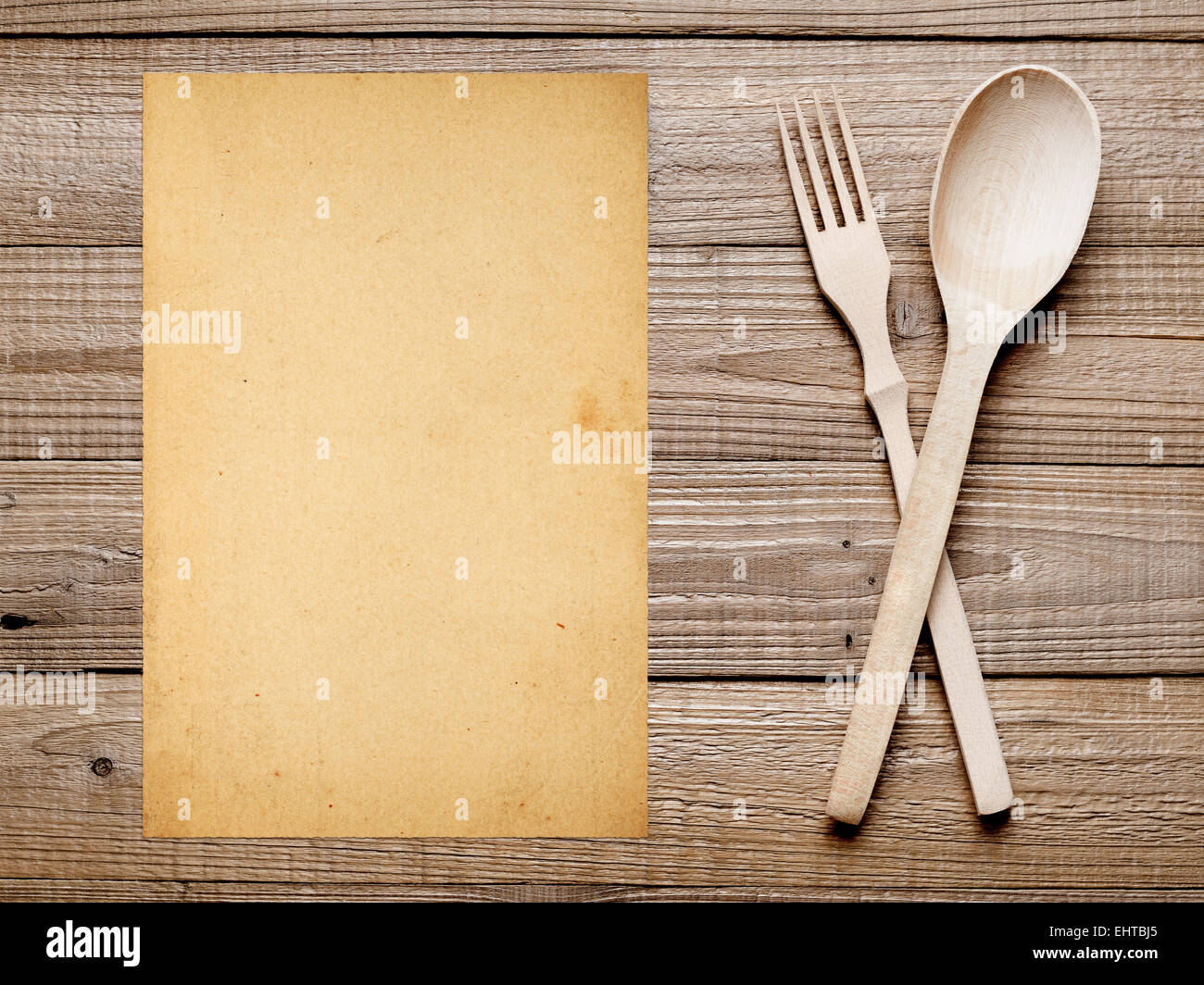 Old paper for menu or recipe background. Fork and spoon on wooden table ...