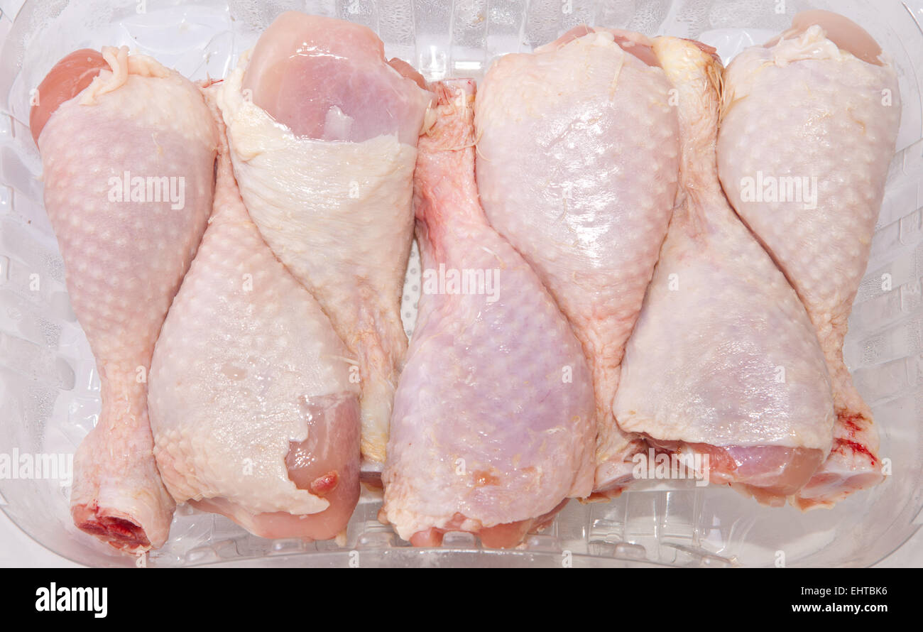 Chicken thighs or legs isolated over white background. Placed on their ...