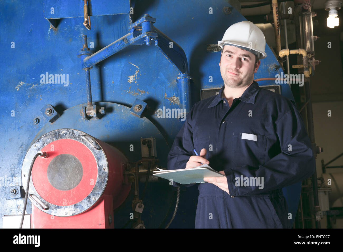 maintenance engineer checking technical data of heating system e Stock ...