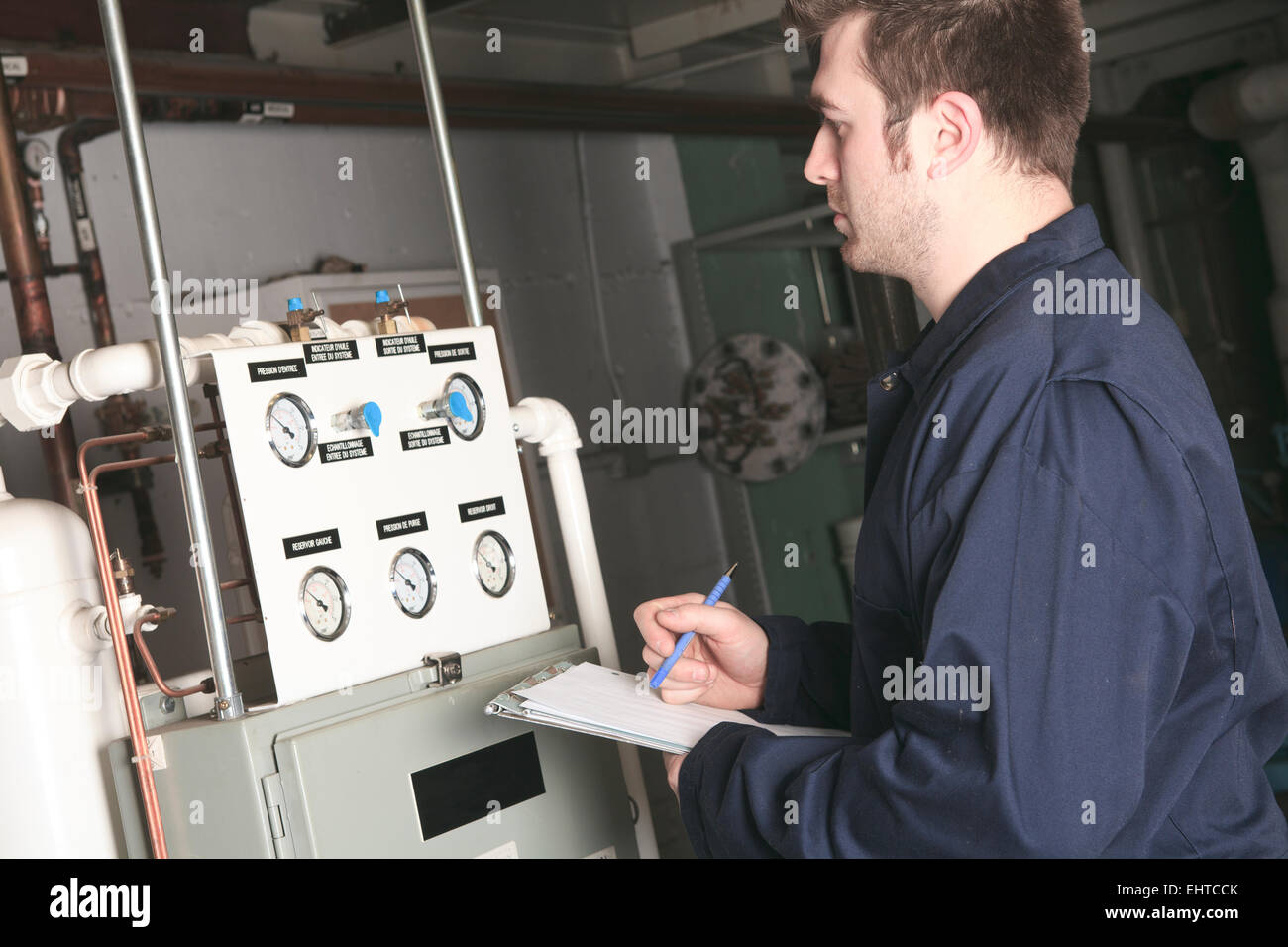 maintenance engineer checking technical data of heating system e Stock ...