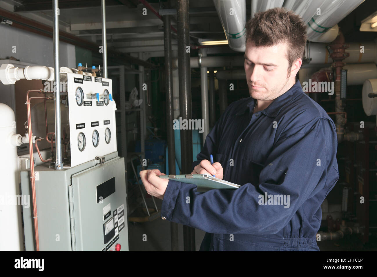 maintenance engineer checking technical data of heating system e Stock ...