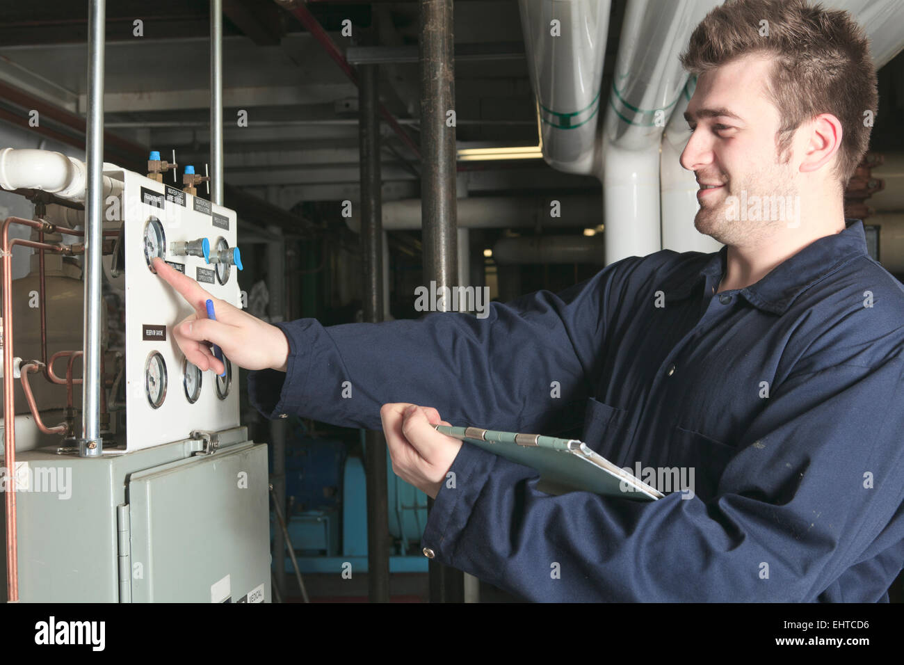 maintenance engineer checking technical data of heating system e Stock ...