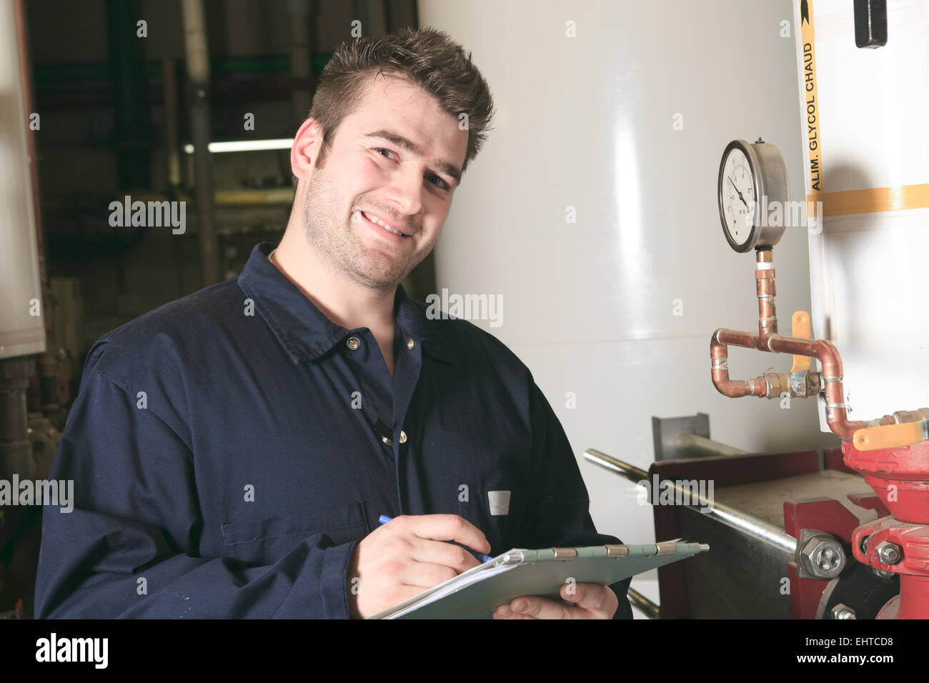 maintenance engineer checking technical data of heating system e Stock ...