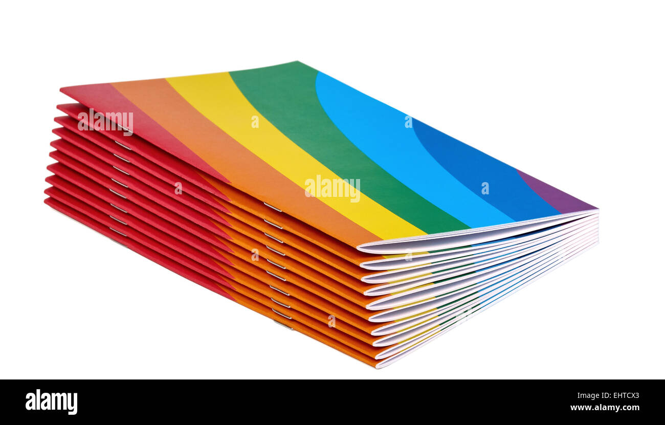 Pile of rainbow magazines isolated on white Stock Photo - Alamy