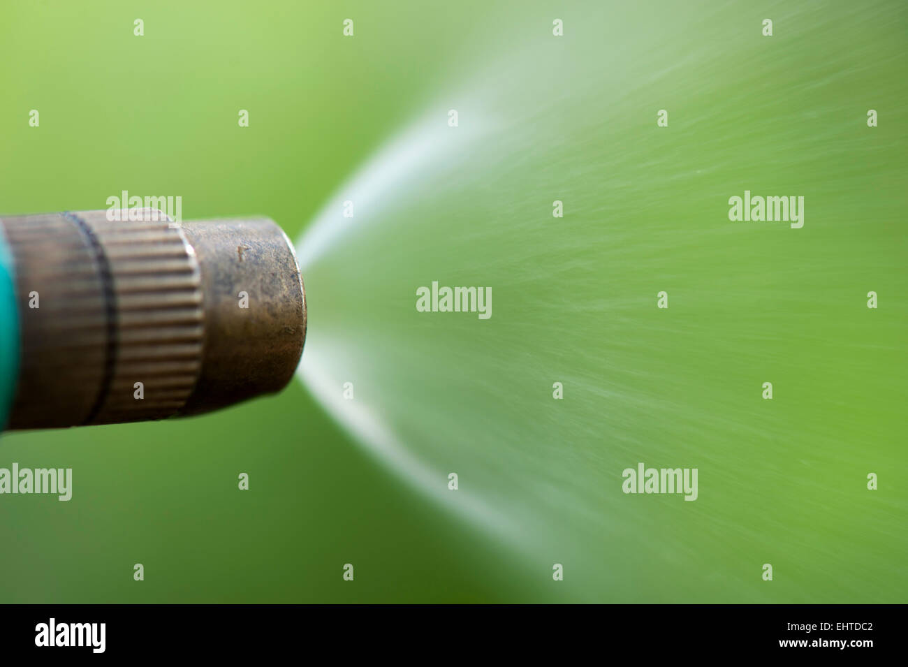 Water jet of a gardeners tool Stock Photo - Alamy