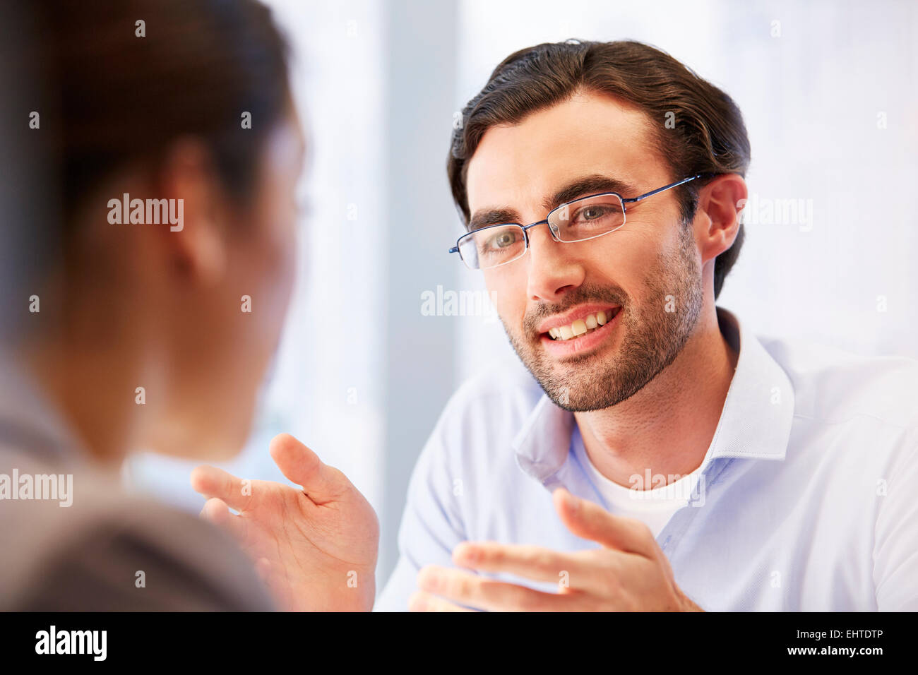 Two business men seated hi-res stock photography and images - Alamy