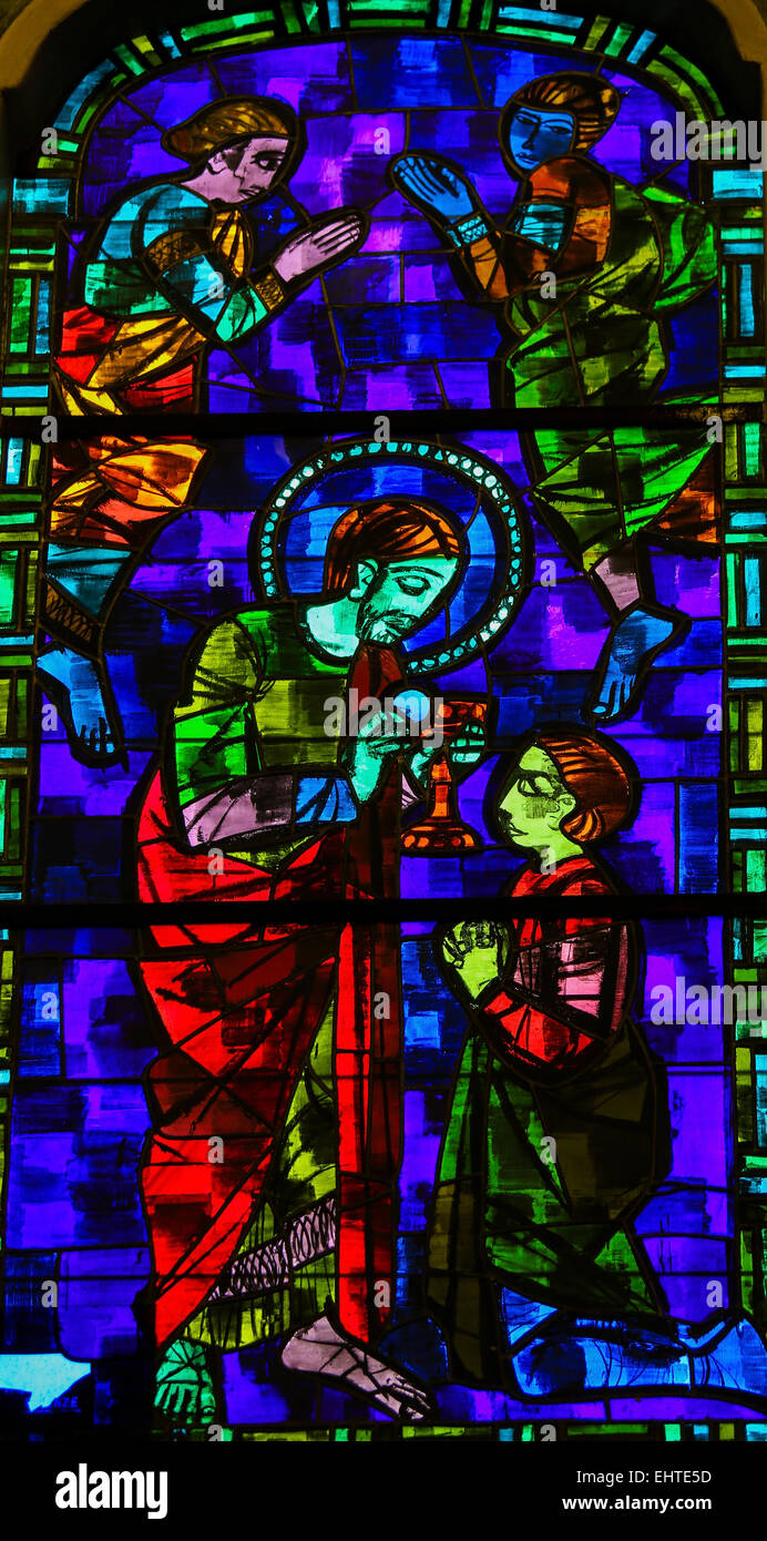Stained glass window depicting Jesus Christ giving communion in the ...