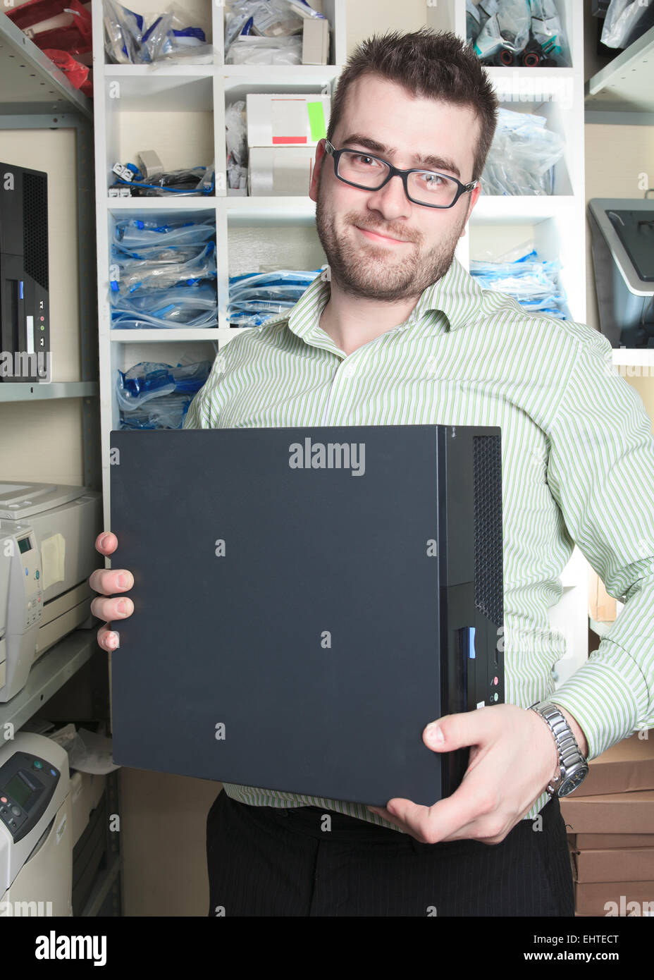 A happy worker technician at work with computer Stock Photo - Alamy