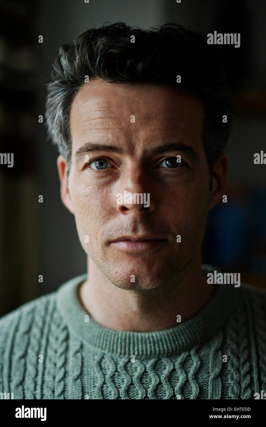 Man in blue sweater on hi-res stock photography and images - Alamy