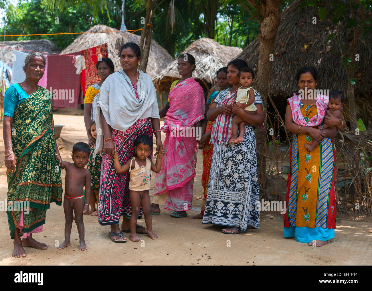Group of women and babies in village setting Stock Photo - Alamy