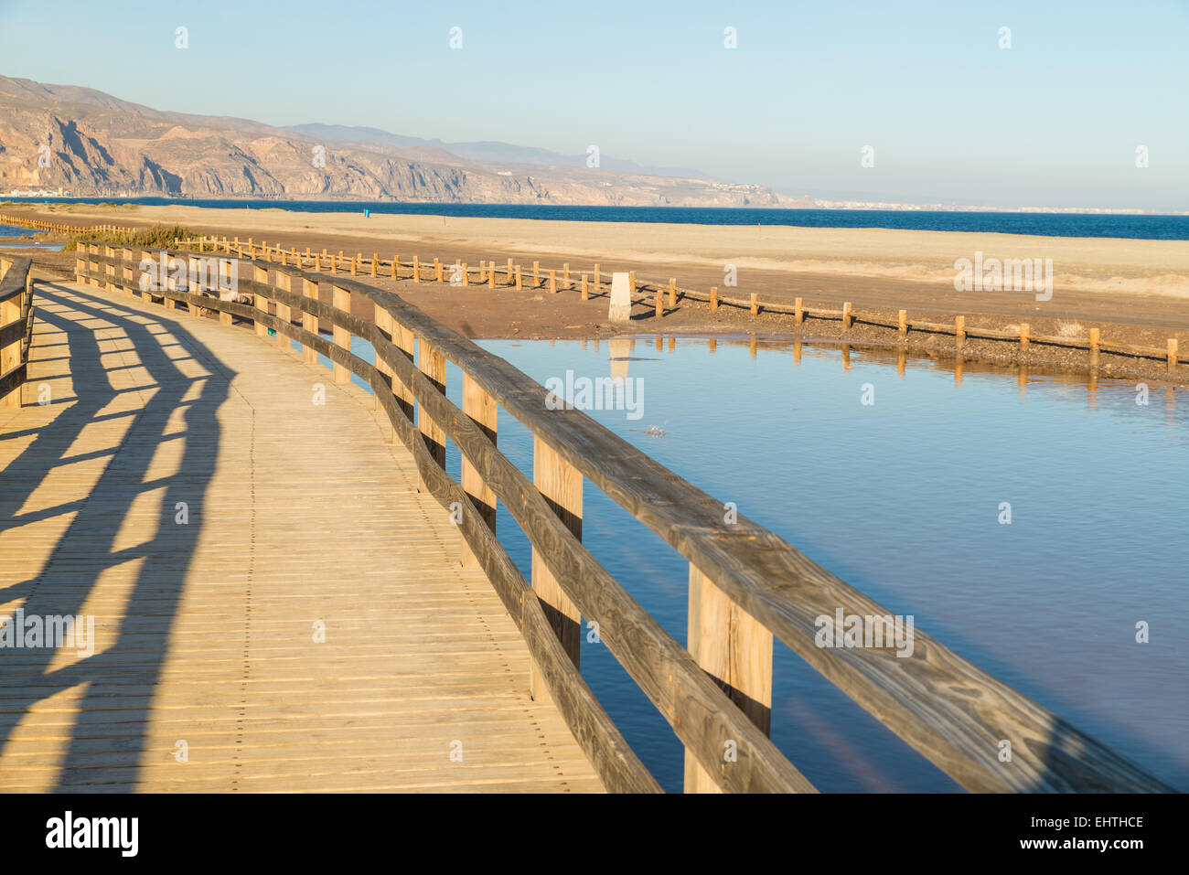 Footbridge over the pools of a salt mine Stock Photo - Alamy