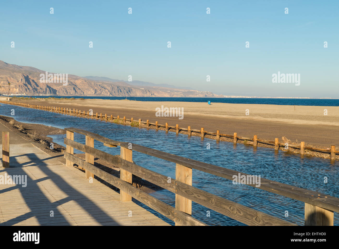 Footbridge over the pools of a salt mine Stock Photo - Alamy