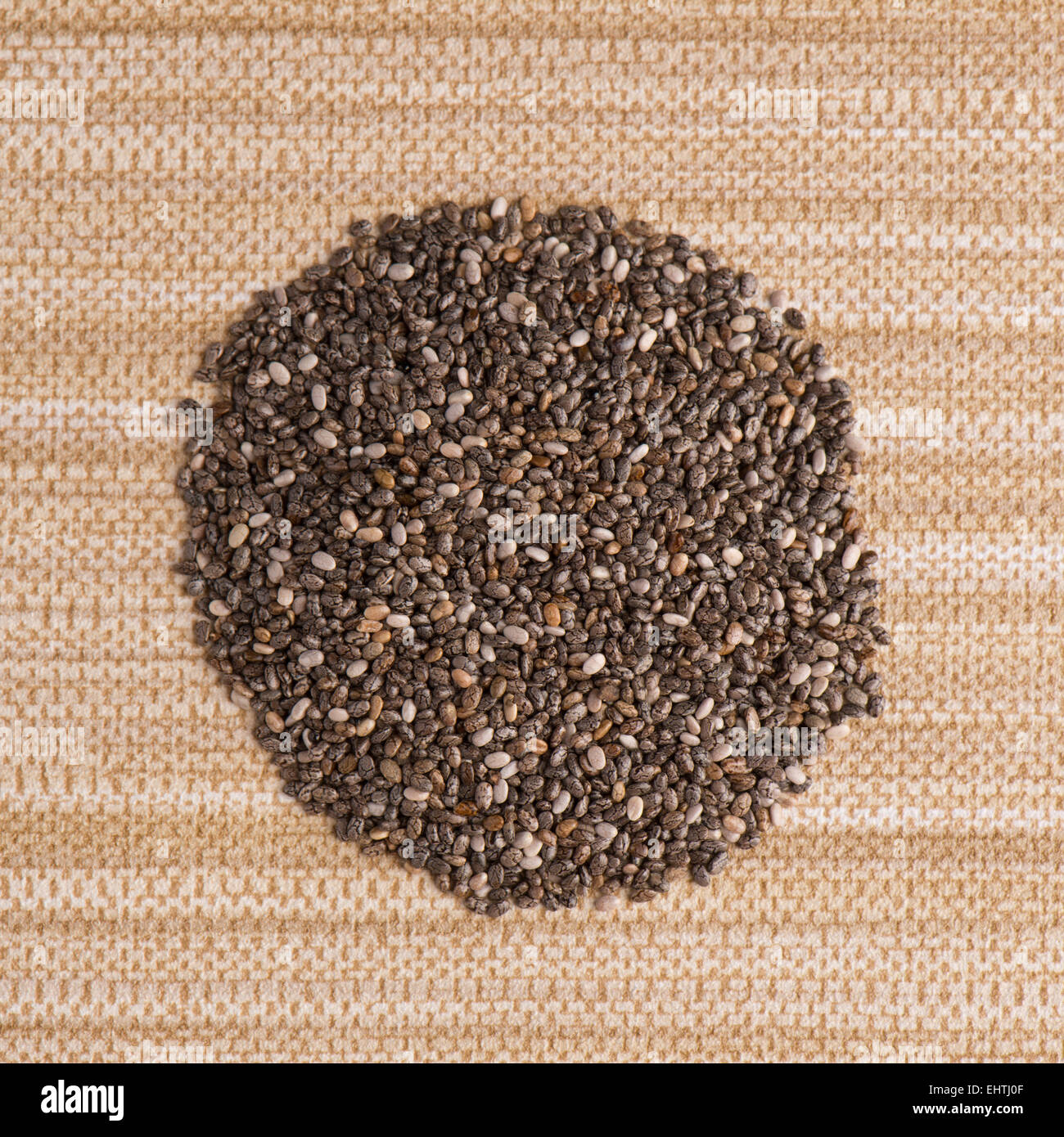 Top view of chia seeds against brown vinyl background Stock Photo - Alamy