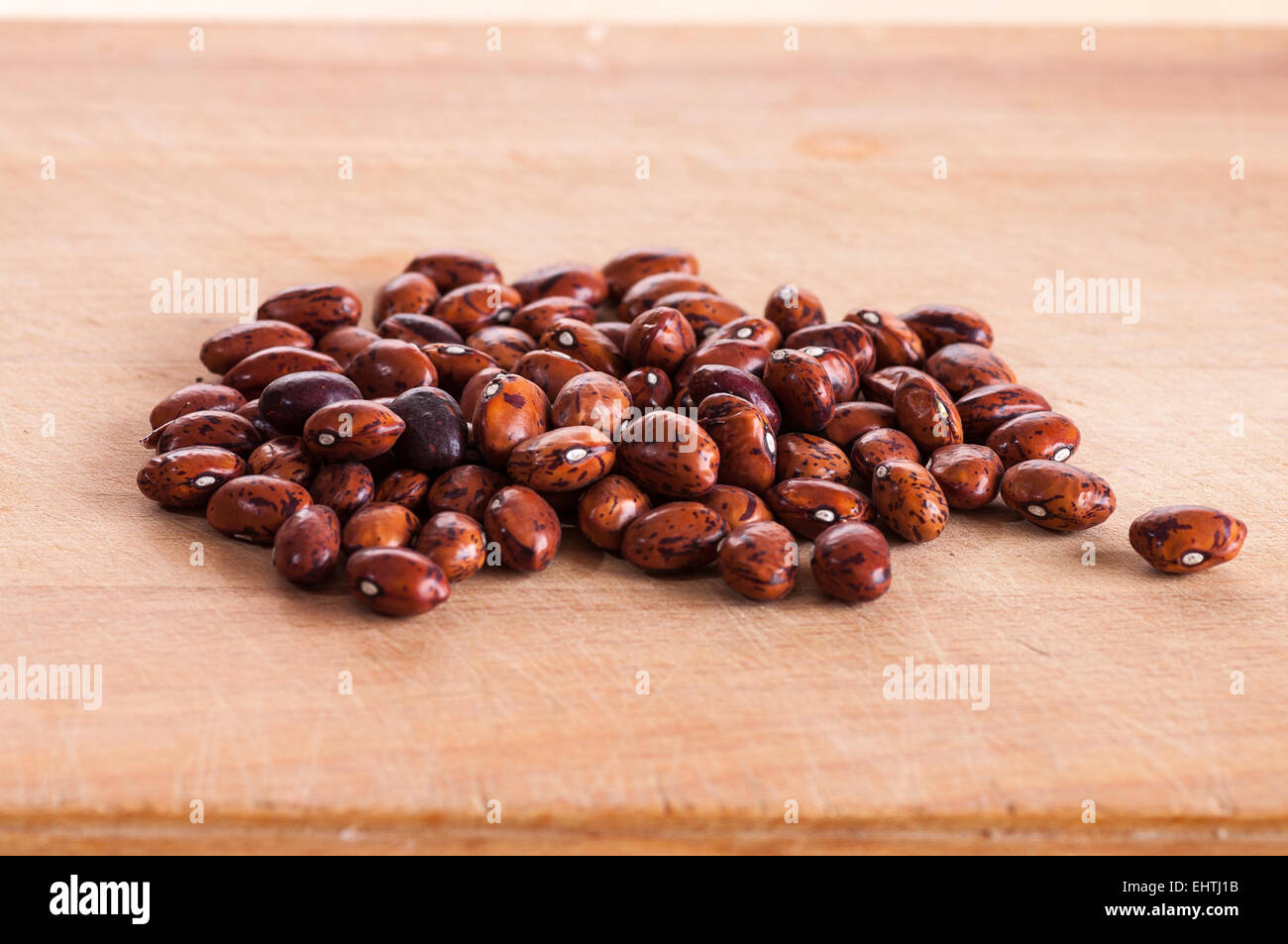 Borlotti beans dried ready for sowing, on wooden board Stock Photo - Alamy