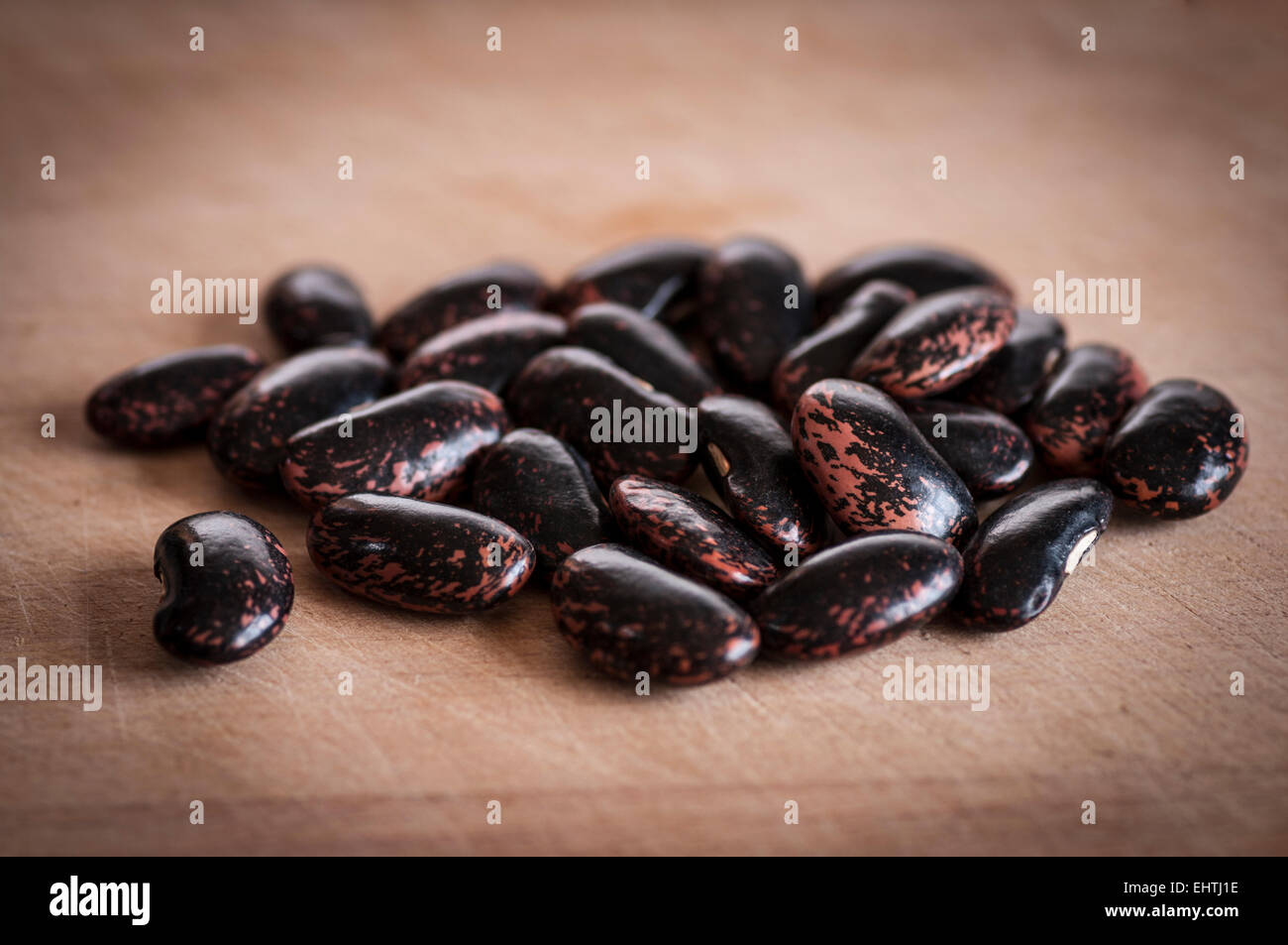 "Celebration" runner beans dried ready for sowing, on wooden board ...