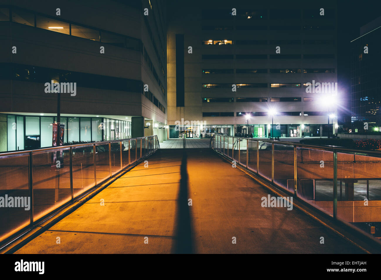Elevated walkway and buildings at night in Baltimore, Maryland Stock ...