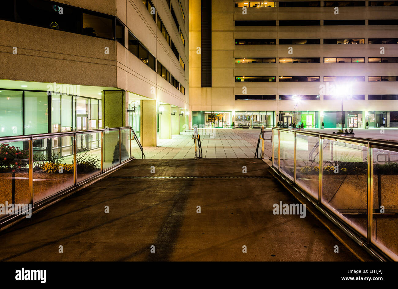 Elevated walkway and buildings at night in Baltimore, Maryland Stock ...
