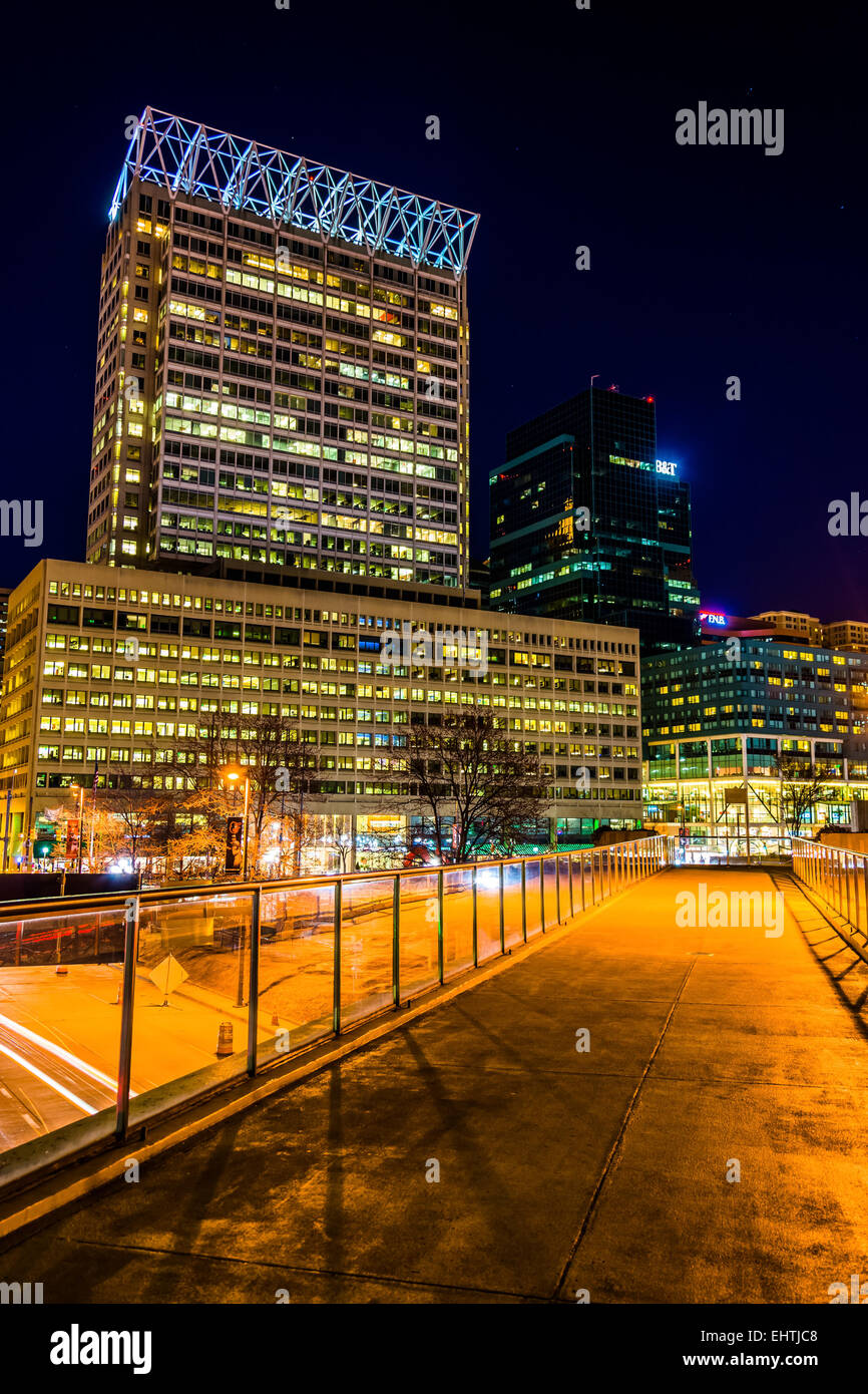 Elevated walkway and modern skyscrapers at night in Baltimore, Maryland ...