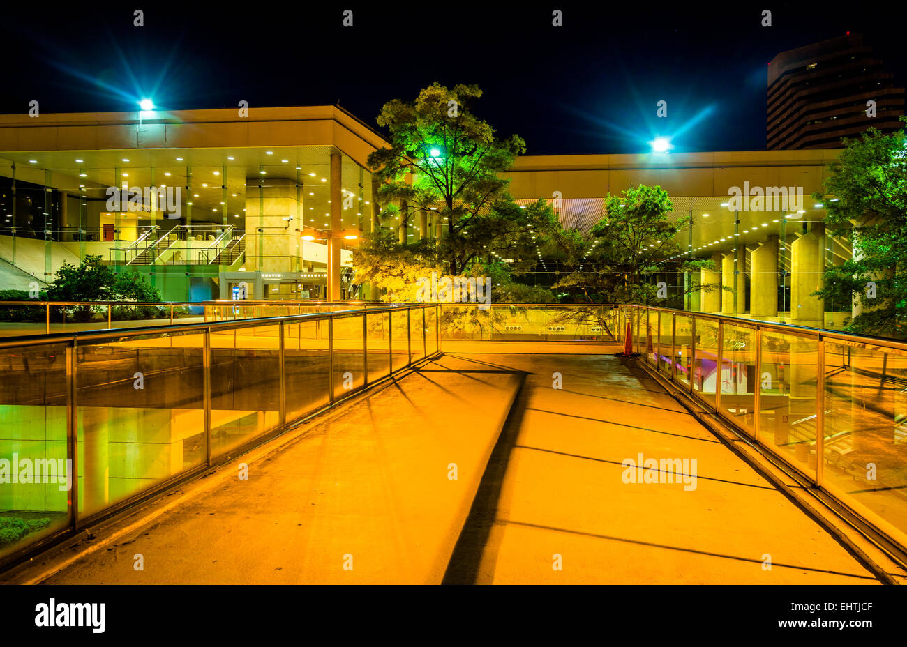 Elevated walkway and the Convention Center at night in Baltimore ...