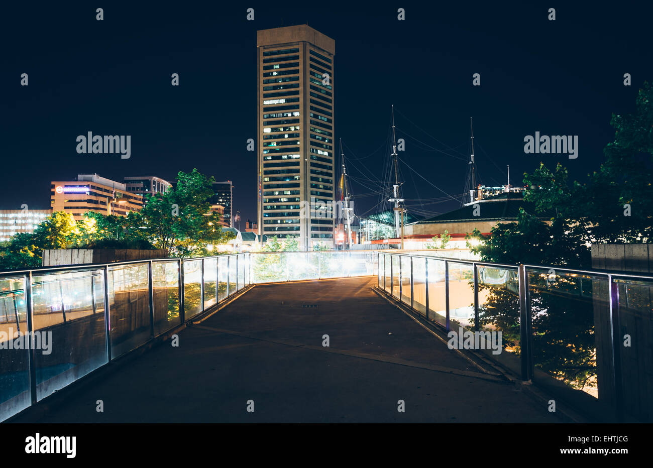 Elevated walkway and the World Trade Center at night in Baltimore ...