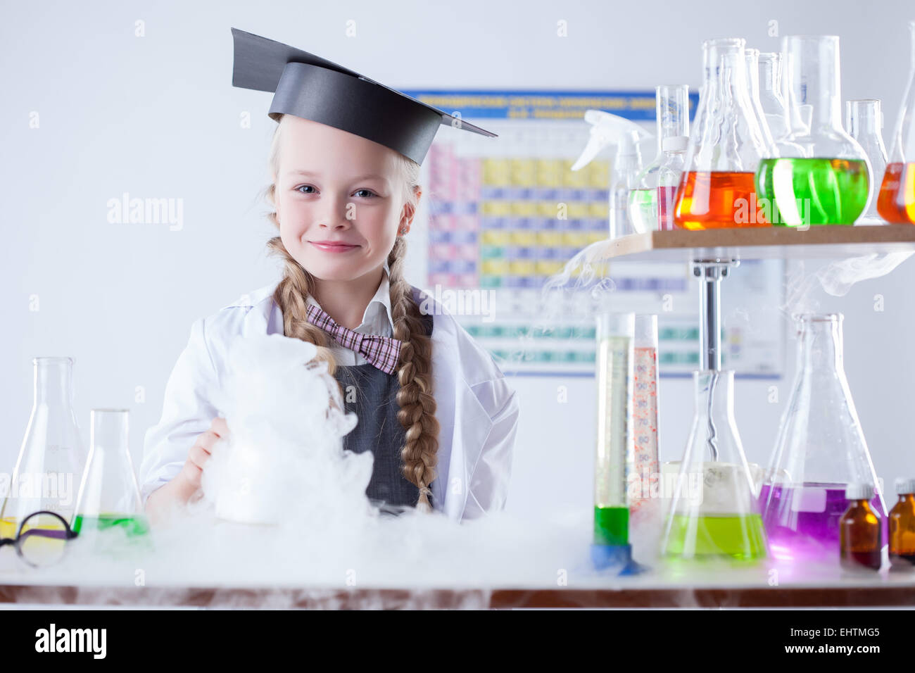 Smiling cute naturalist conducting experiment Stock Photo - Alamy