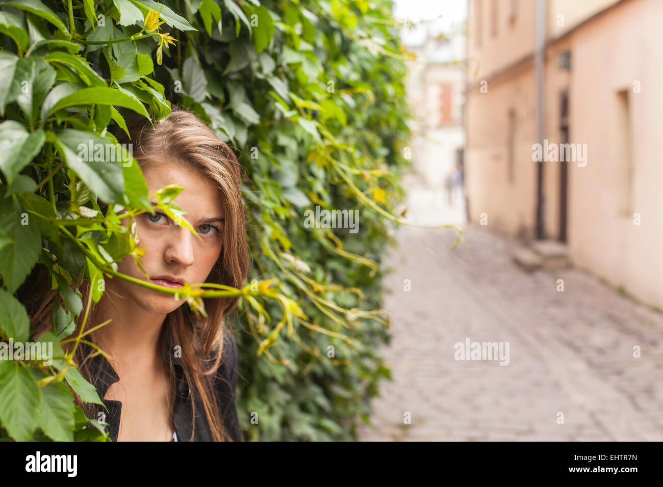 Woman hiding face by hair hi-res stock photography and images - Alamy