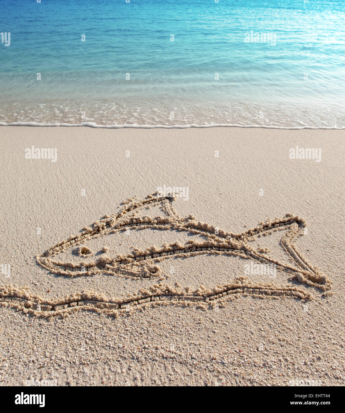 The fish - a picture on sand Stock Photo - Alamy