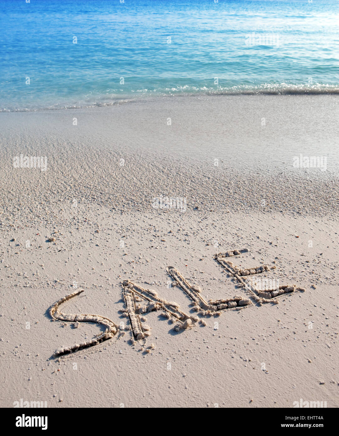 text on sand - sale Stock Photo - Alamy
