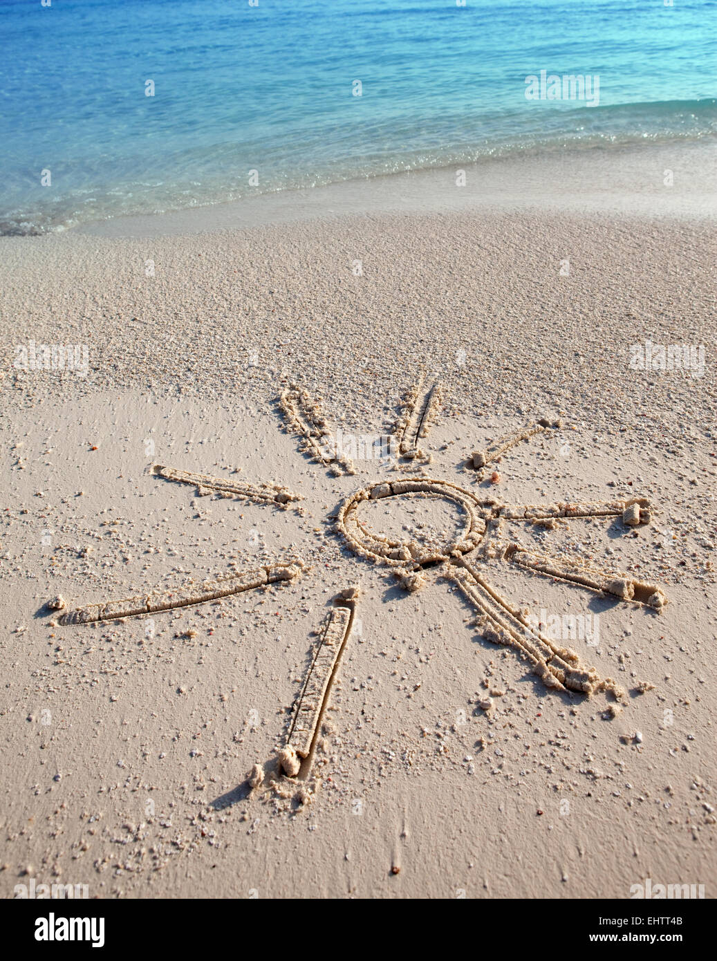 The sun - a picture on sand Stock Photo - Alamy
