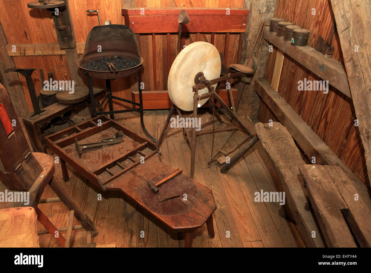 Traveling blacksmith equipment including a grindstone Stock Photo - Alamy