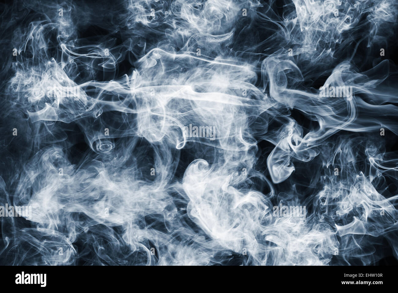 Fluffy Puffs of Smoke and Fog on Black Background Stock Photo - Alamy