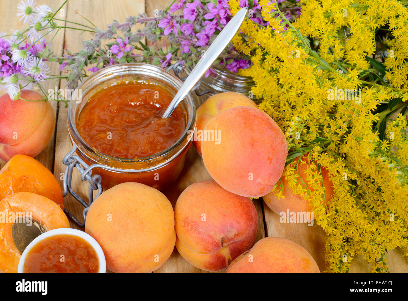 apricot jam with fruit and yellow flowers Stock Photo - Alamy
