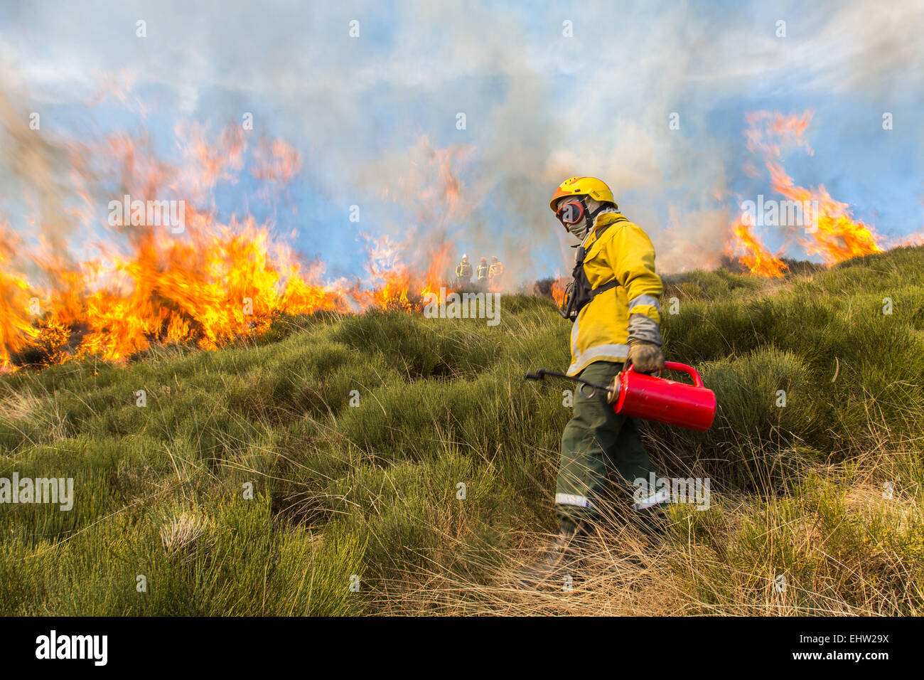 Fireman beating fire hi-res stock photography and images - Alamy