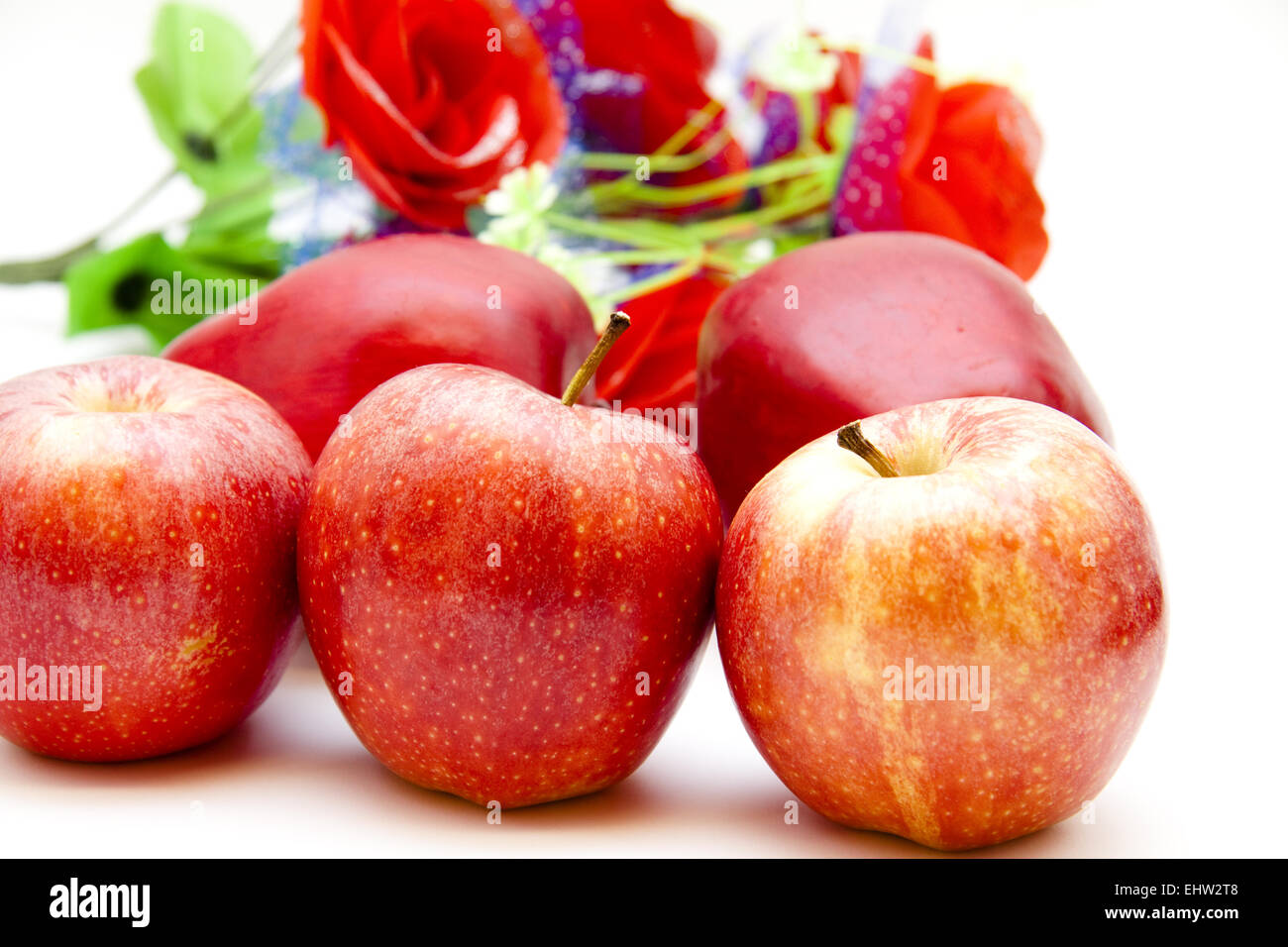 Red apples with roses Stock Photo - Alamy