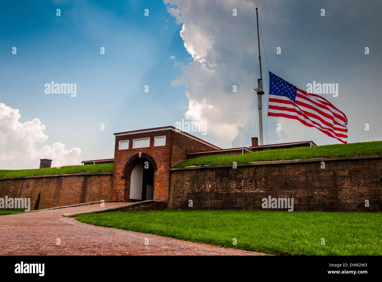 Summer storm clouds and American flag over Fort McHenry in Baltimore ...