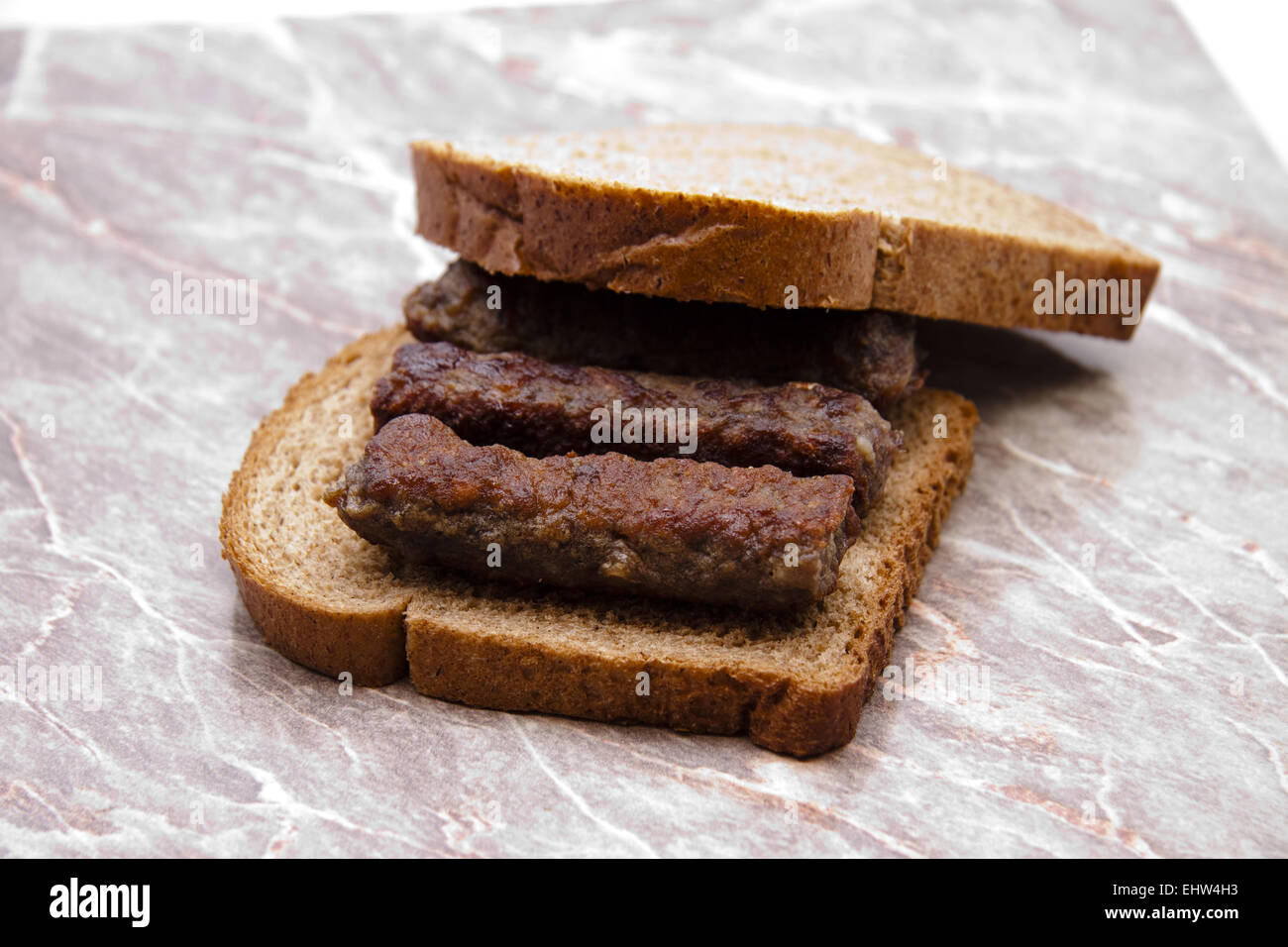 Little minced meat roles with toast Stock Photo - Alamy