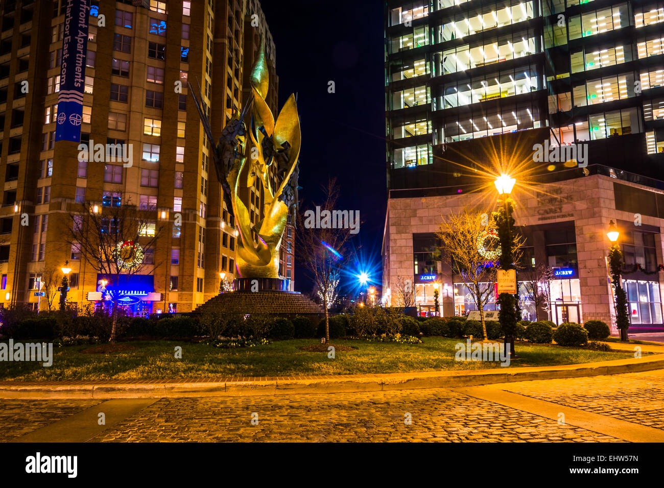 Traffic circle and modern buildings at night in Baltimore, Maryland ...
