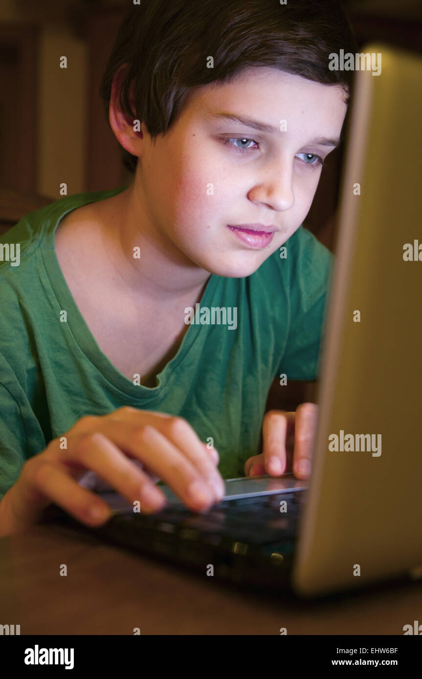 boy looking at monitor Stock Photo - Alamy