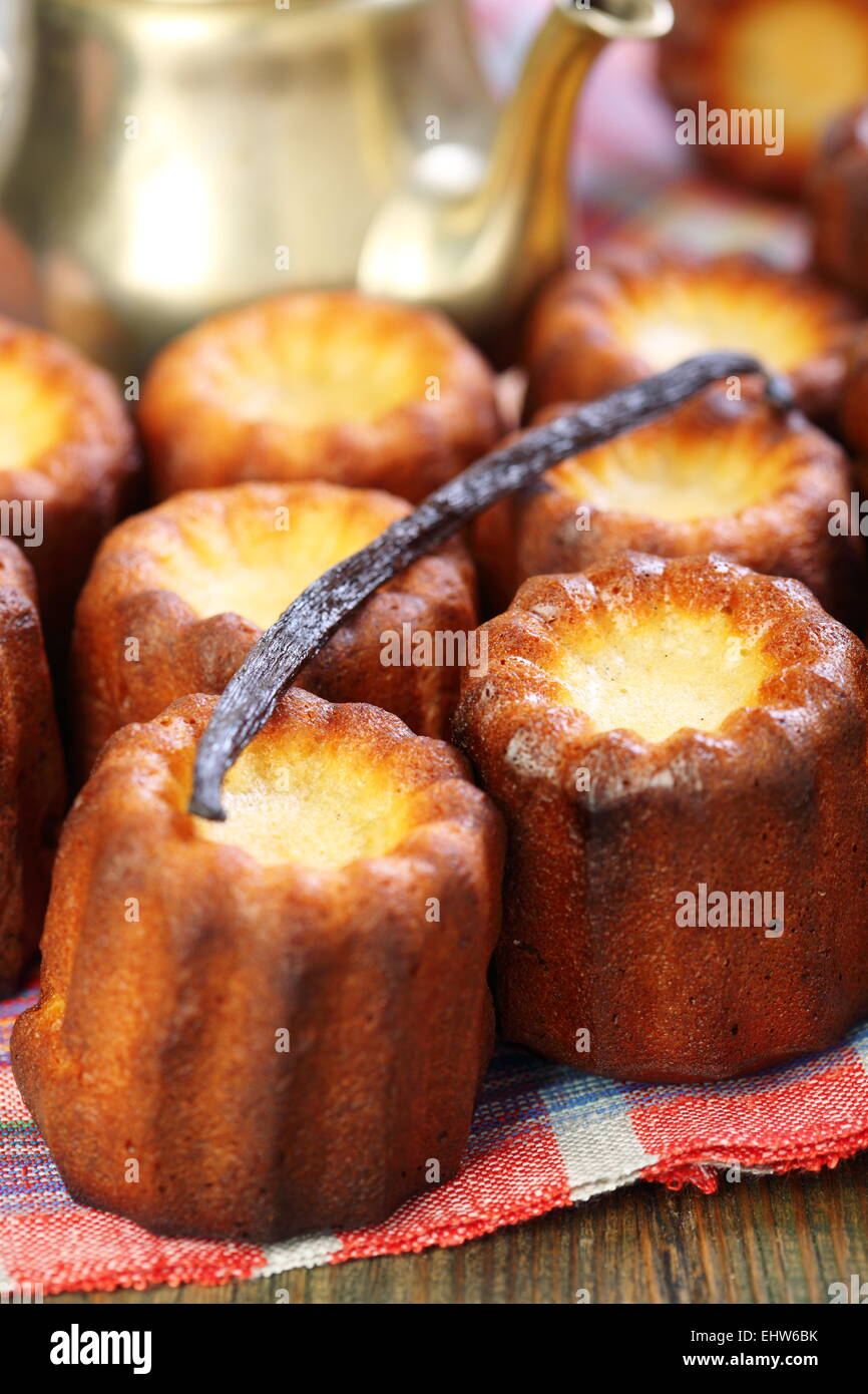 Small French cakes Canele and vanilla Stock Photo - Alamy