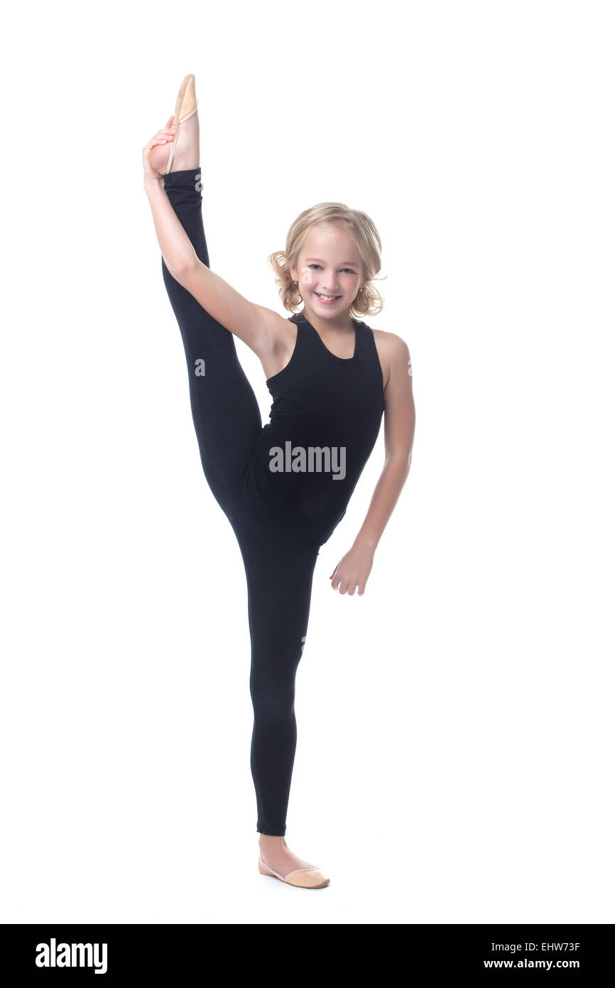Cute little gymnast posing in vertical split Stock Photo - Alamy